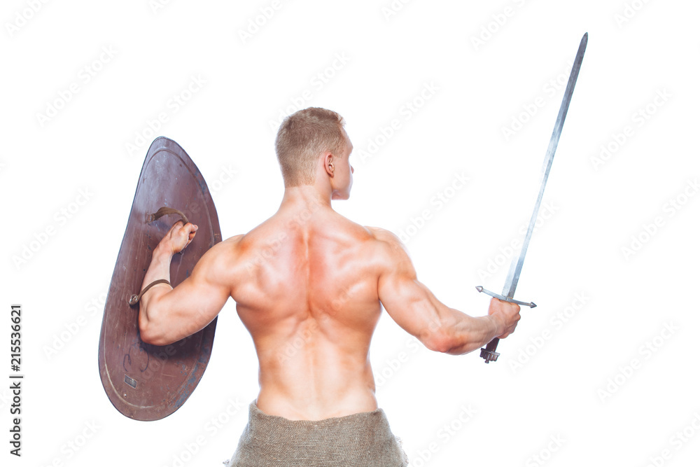 Bodybuilder man posing with a sword and shield isolated on white ...