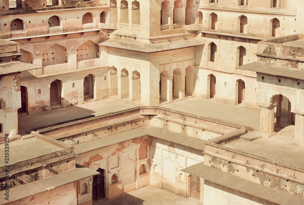 Stone maze of arches and columns inside the indian palace. Example of ...