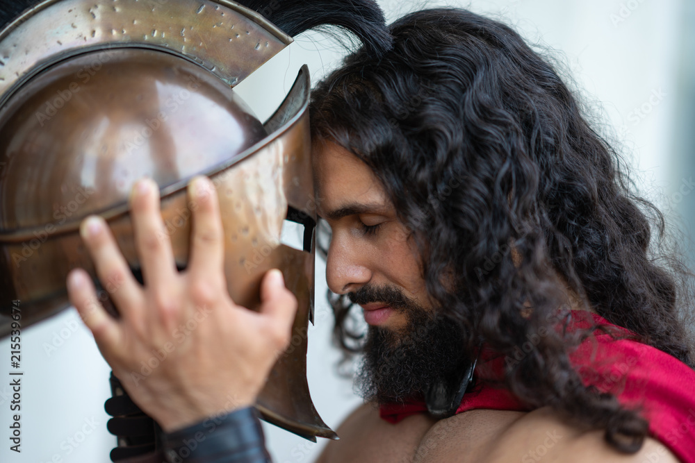 the Roman soldier leaned against the helmet Stock Photo | Adobe Stock