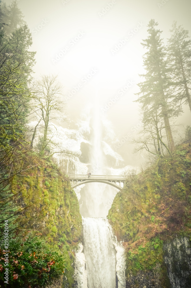 Vintage tone icy Multnomah Falls in winter time. It is a waterfall on ...