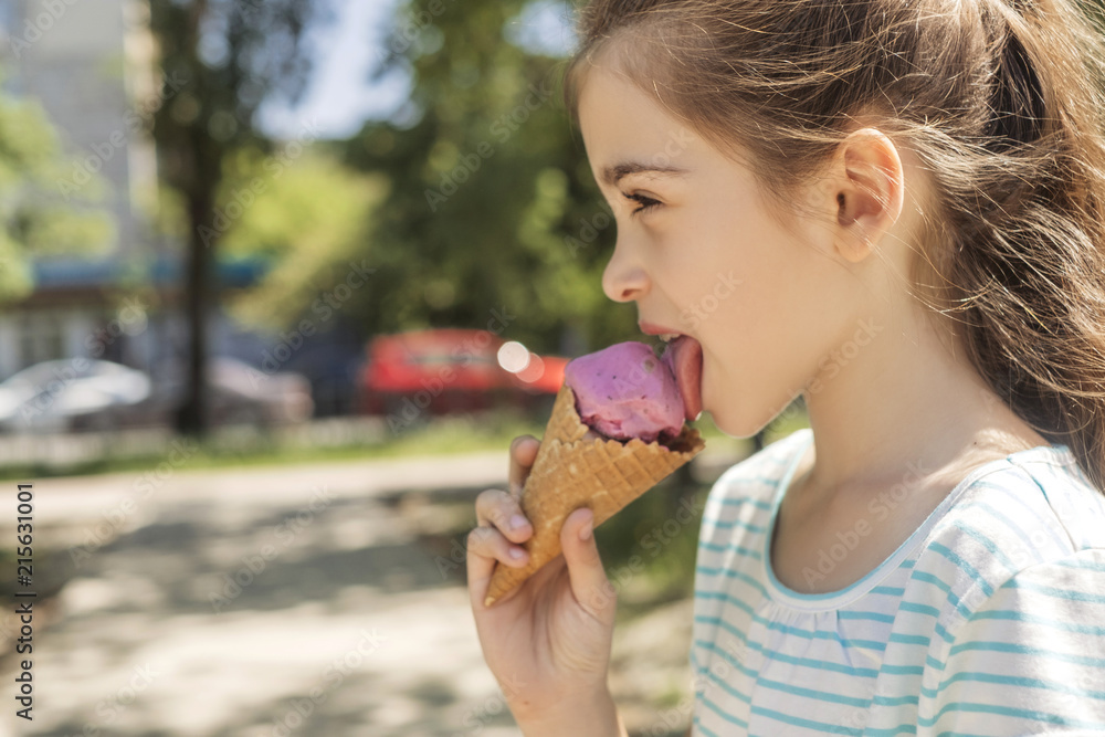 Cute little 10 years old girl in casual outfit playing at park in warm ...