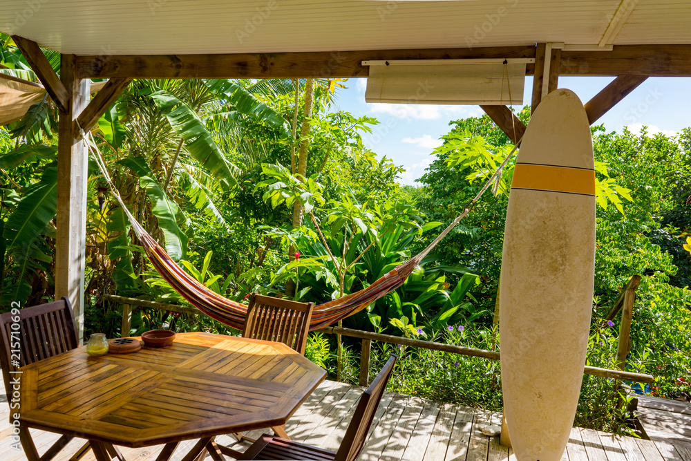 Surfer home at beach, house with surf boards at coast or shore, cabin ...