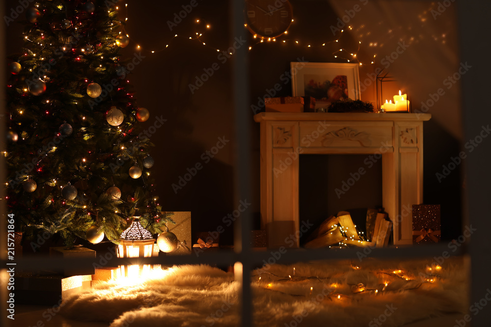 Stylish living room interior with decorated Christmas tree and ...