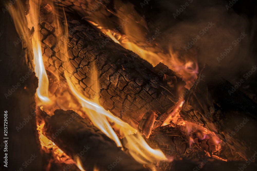 Fire moves across the wood without stop increasing it flames with the ...