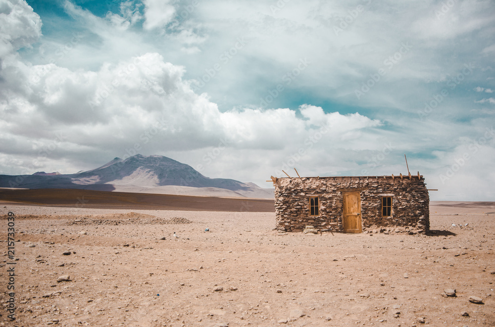 Small stone and straw house on the border of Chile and Bolivia, in the ...
