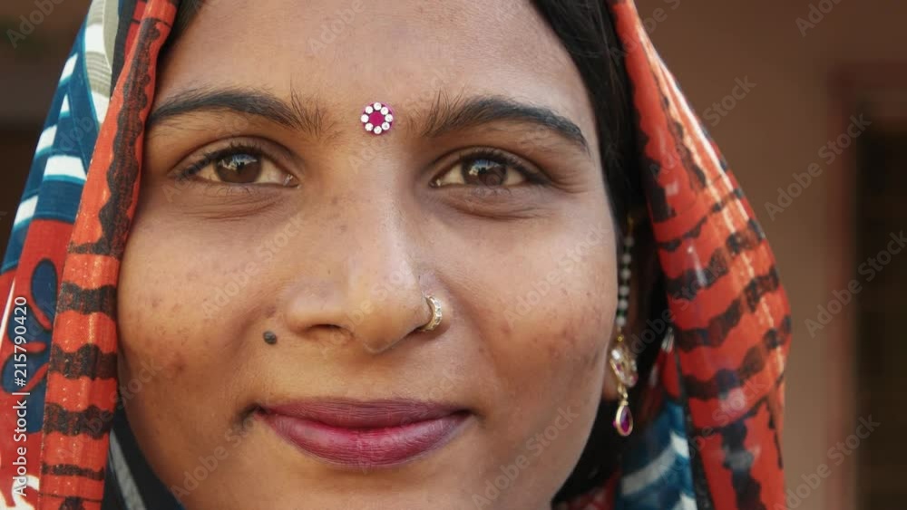 Extreme close up of a gorgeous Indian woman's face smiling laughing ...