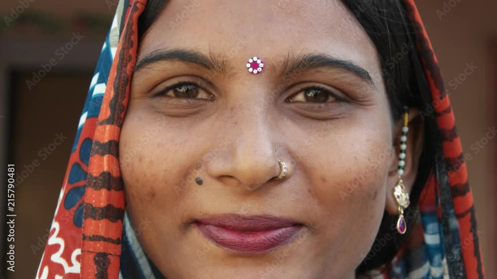 Extreme close up of a gorgeous Indian woman's face smiling laughing ...