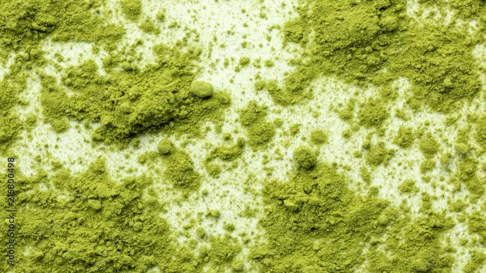 Matcha green tea ground an flat white background, top view Stock-Video ...