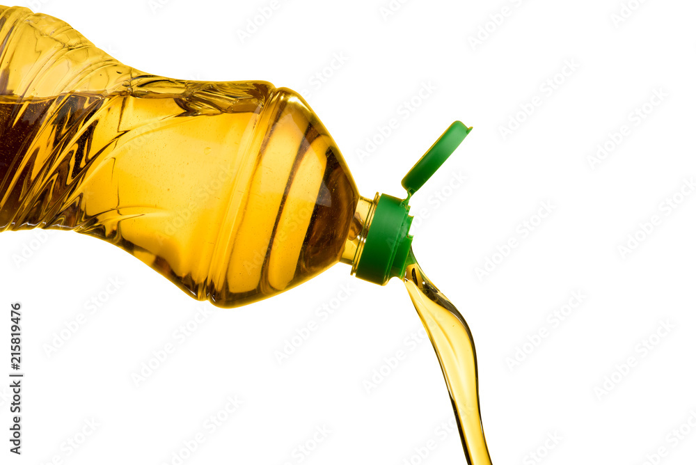 Pouring vegetable oil isolated on white background raw food cooking ...