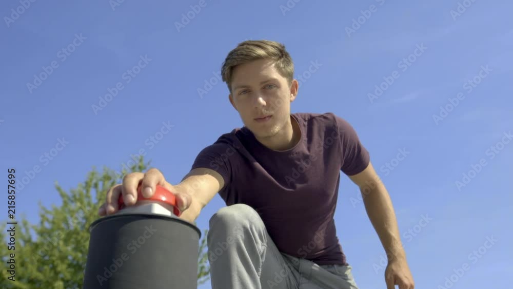 Filmed from down below: charismatic young freerunner who presses red ...
