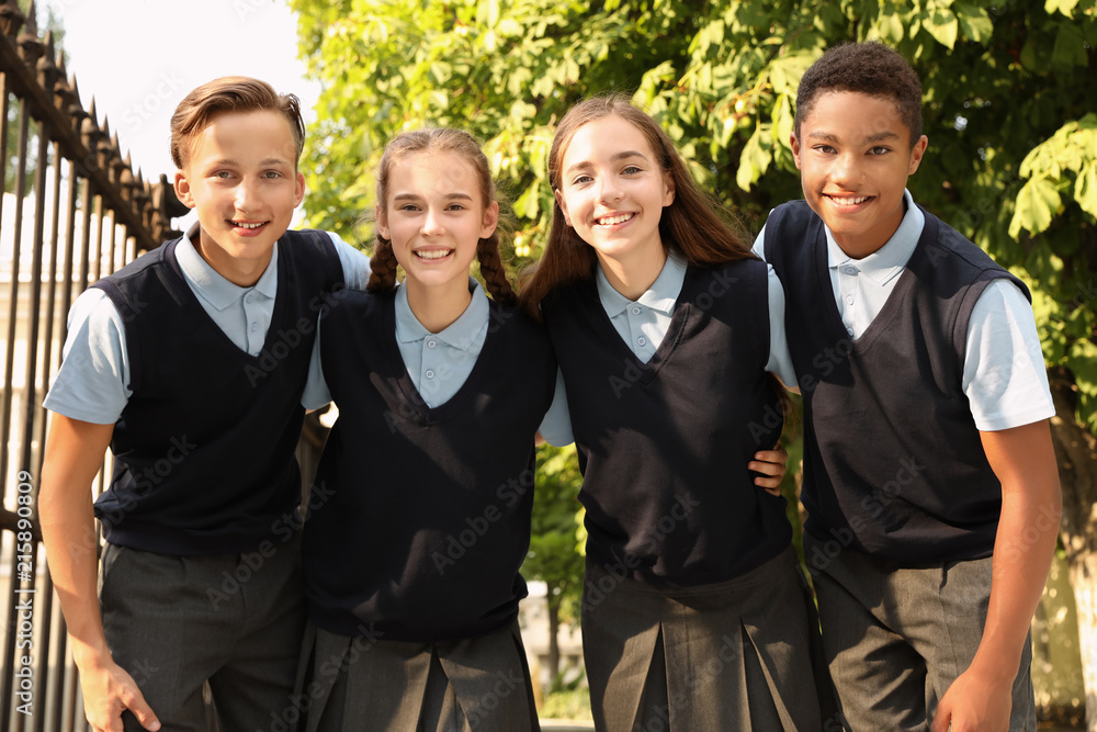 Teenage students in stylish school uniform outdoors Stock Photo | Adobe ...