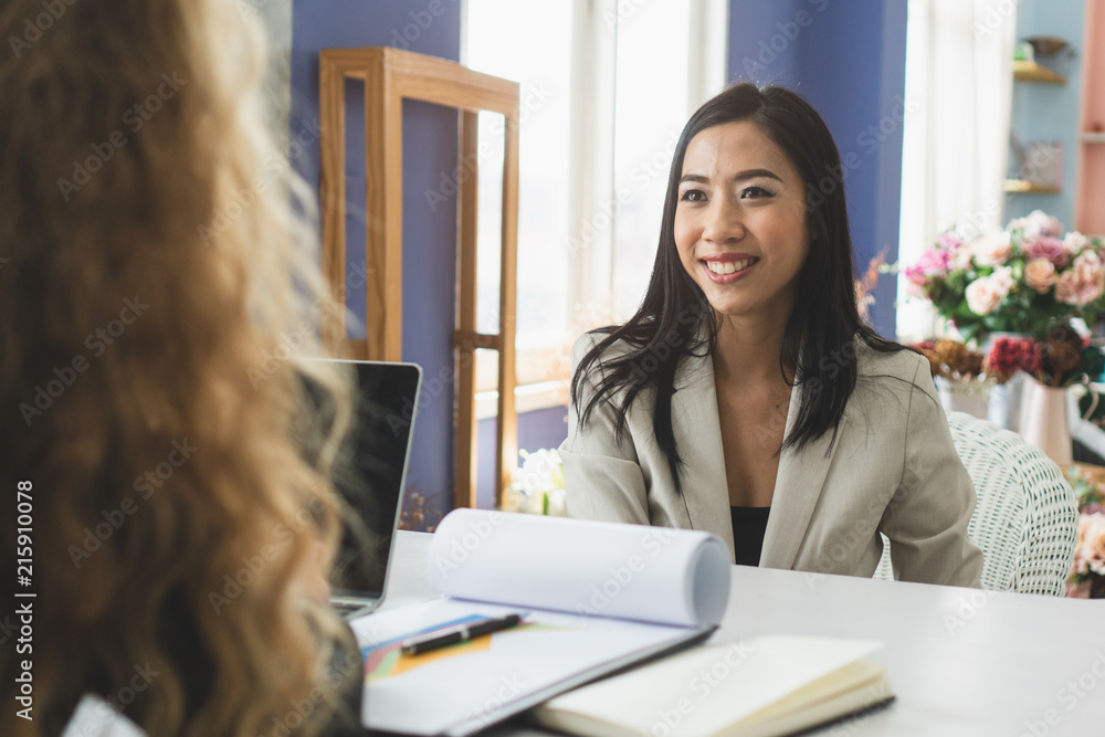 Friendly business woman interviewing new applicant candidate for ...