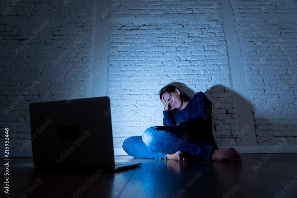 Sad and scared female Young woman with computer laptop suffering ...