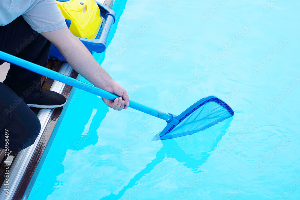 Pool cleaner during his work. Cleaning robot for cleaning the botton of ...