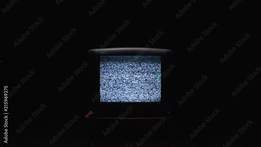 TV screen on at night with a white noise. Stock. Static noise on the ...