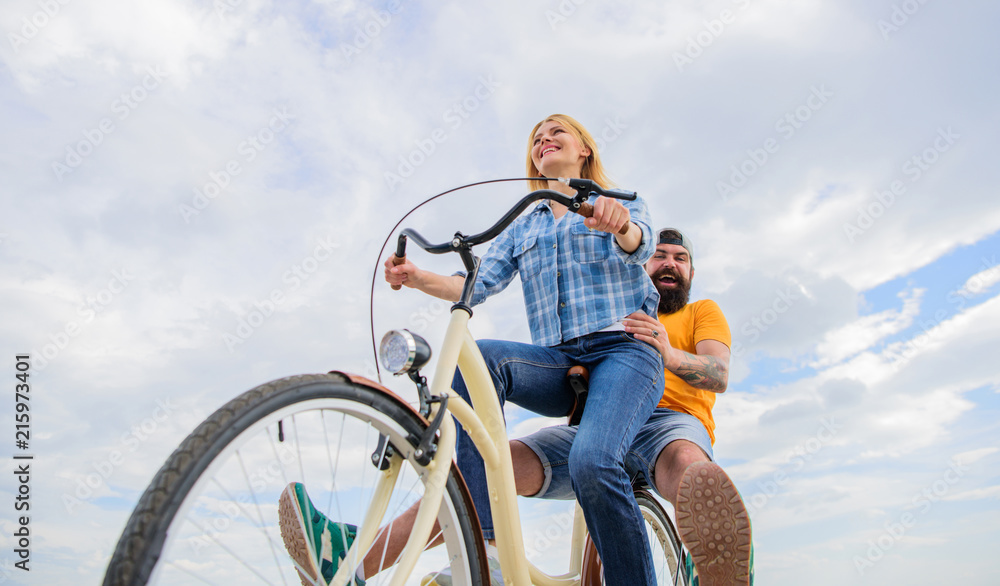 Youth have fun riding bike sky background. Enjoy summer holidays ...