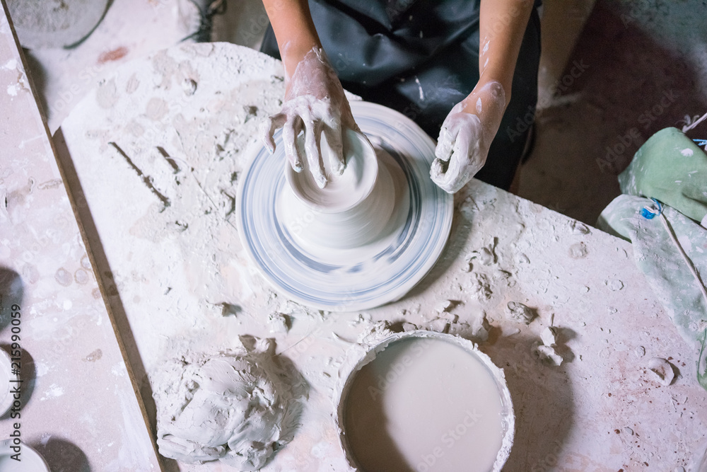 Ceramic dishes in working process. Creating ceramic pieces. Tradicional ...