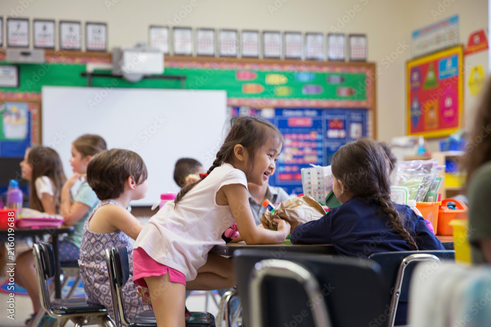 Students in a kindergarten classroom. Stock Photo | Adobe Stock