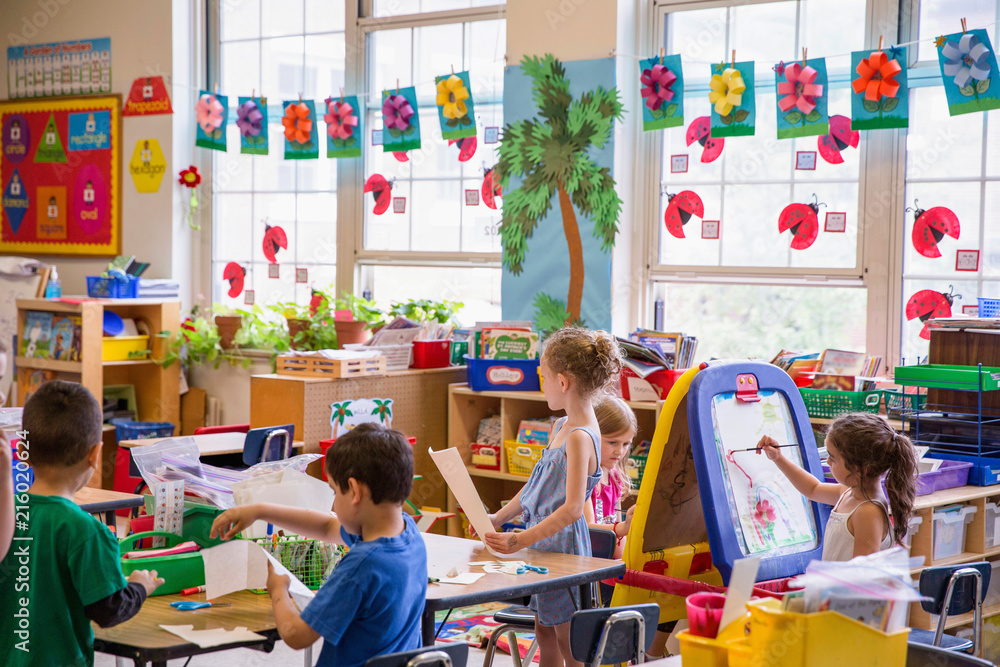 Students working in a kindergarten classroom. Stock Photo | Adobe Stock Students working in a kindergarten classroom. Stock Photo | Adobe Stock
