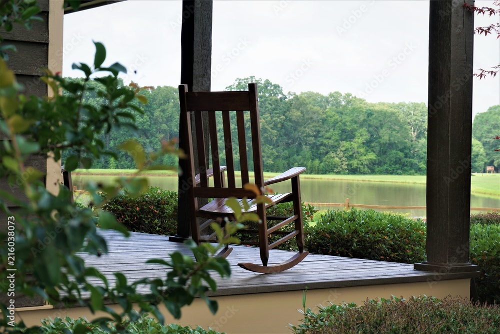 The wooden rocking chair at the beautiful view terrace is waiting for ...