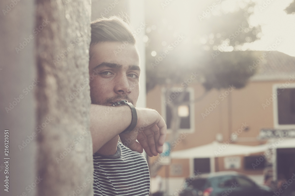 beautiful caucasian young boy looking at the camera directly and strong ...