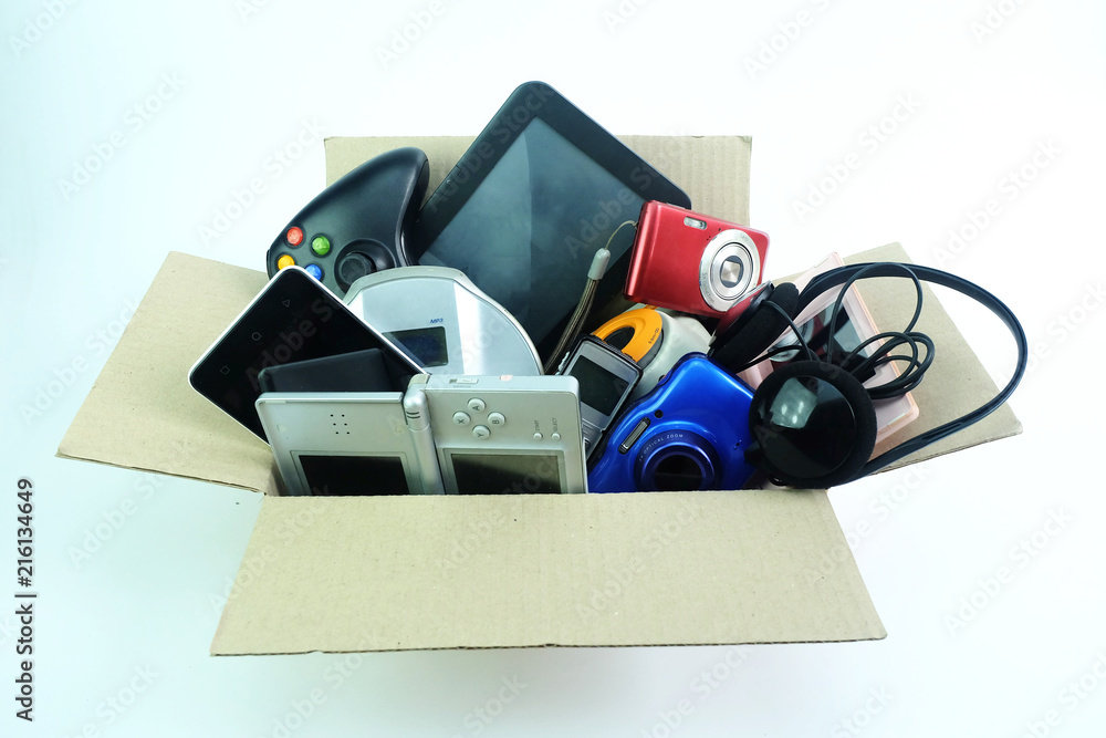 Paper box with the damaged or old used electronics gadgets for daily ...