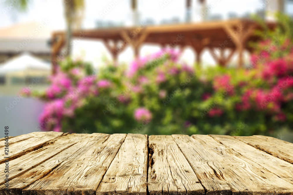 Table background of free space for your products and flowers of red ...