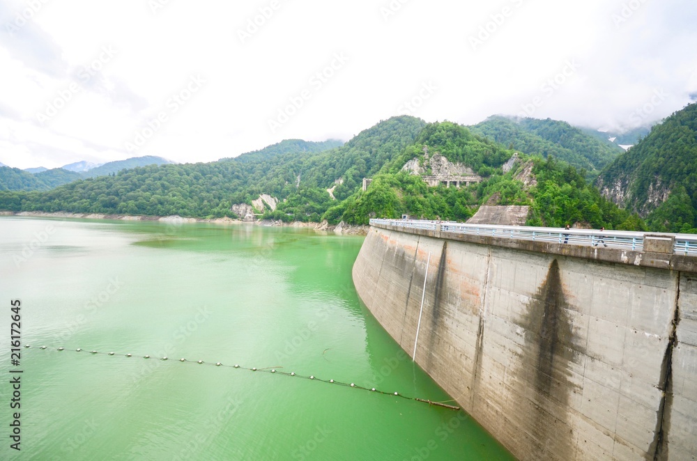 View of the Arch of Kurobe Dam and Emerald Green Water Along Tateyama ...
