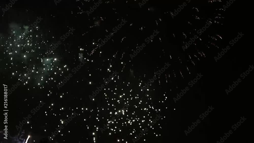 Colorful rain showers of fireworks on the dark night background ...