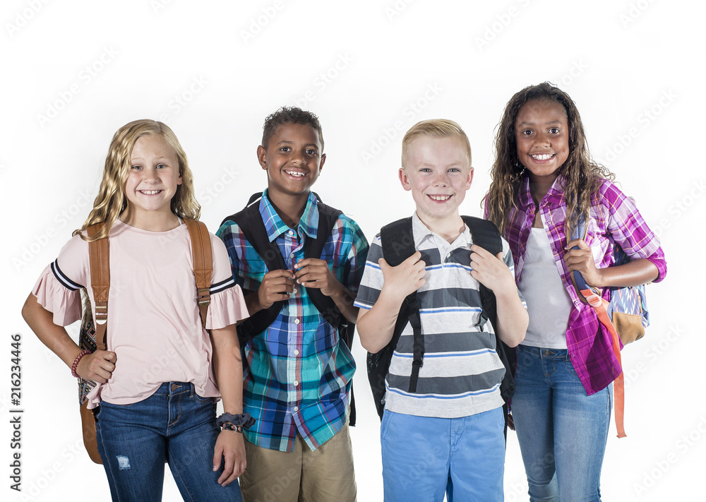 Group portrait of pre-adolescent school kids smiling on a white ...