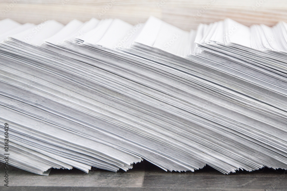 load at work: Huge stack of envelopes with working mail on the ...