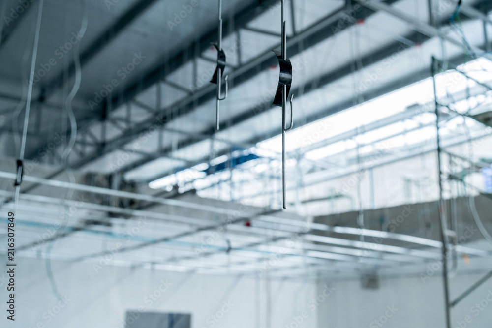 construction concept with gypsum ceiling with hanging structure install ...
