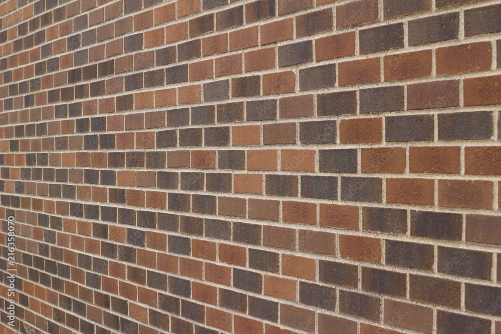 Angled view of a traditional running bond brick wall background with ...