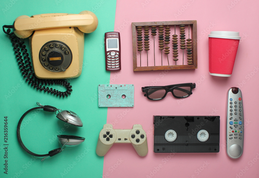 Retro objects on pastel background. Rotary telephone, audio cassette ...