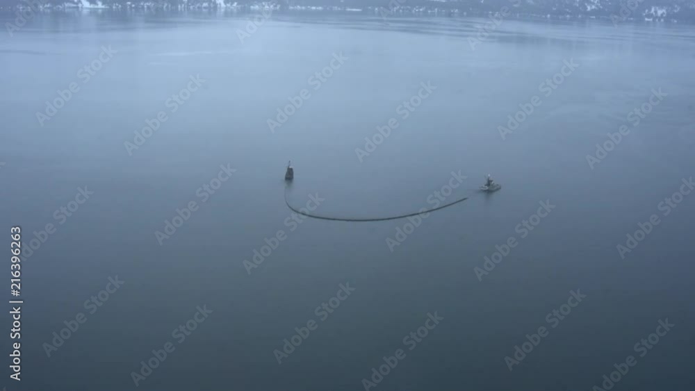 Two fishing boats pulling a boom in an oil spill training exercise ...