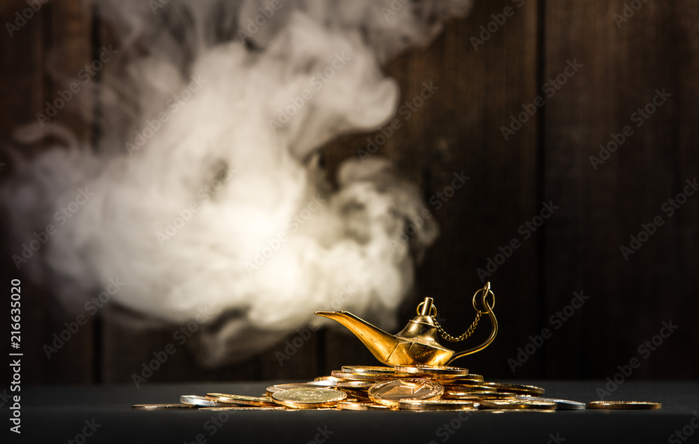 Magic lamp of wishes on stacks of gold coins with smoke coming out from ...