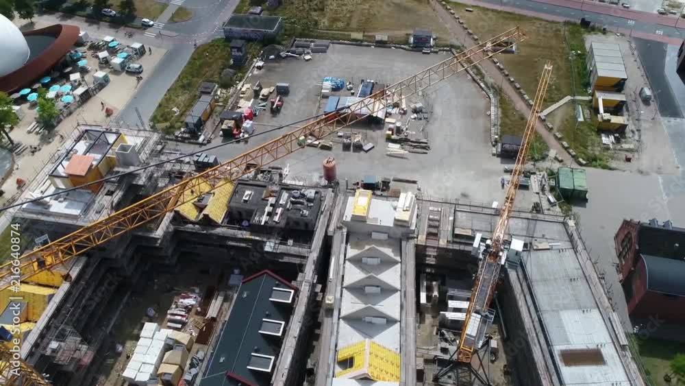 Aerial footage of construction site showing the buildings in process ...