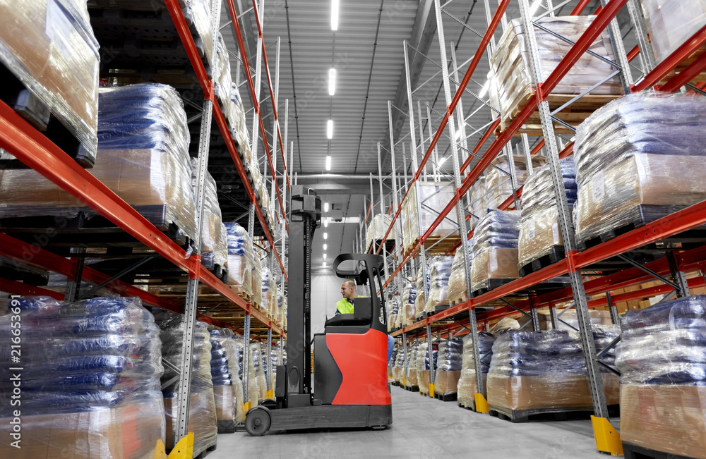 logistic business, shipment and loading concept - male loader operating ...