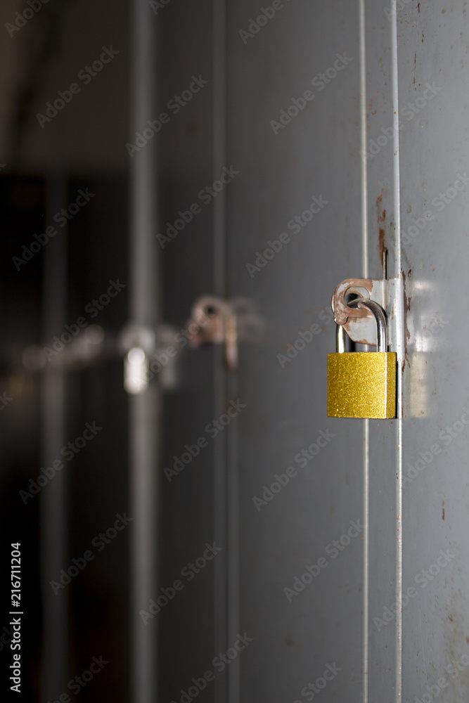 Grey neutral lockers with padlocks for gym, dressing room, company ...