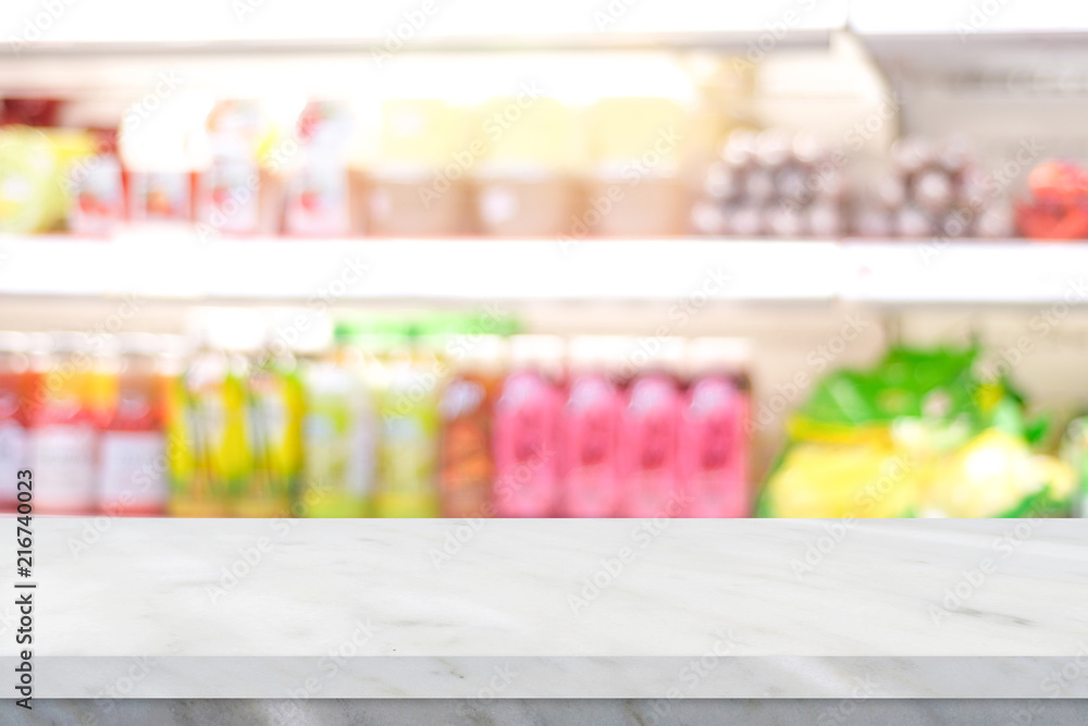 Fototapeta Empty white cement table over blur product shelf at grocery ... Fototapeta Empty white cement table over blur product shelf at grocery ...