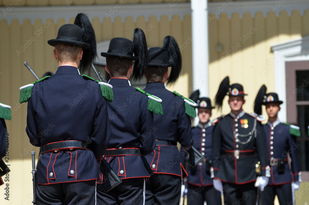 Norwegian soldiers in gala uniforms changing honor guard in front of the Royal Palace.. Oslo ...