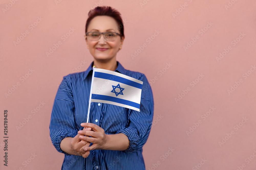 Israel flag. Woman holding Israeli flag. Nice portrait of middle aged ...