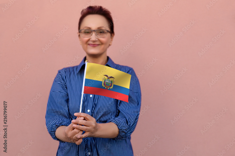 Ecuador flag. Woman holding Ecuadorian flag. Nice portrait of middle ...