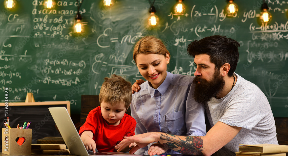 Lecturer discussing architectural issues with students during workshop ...