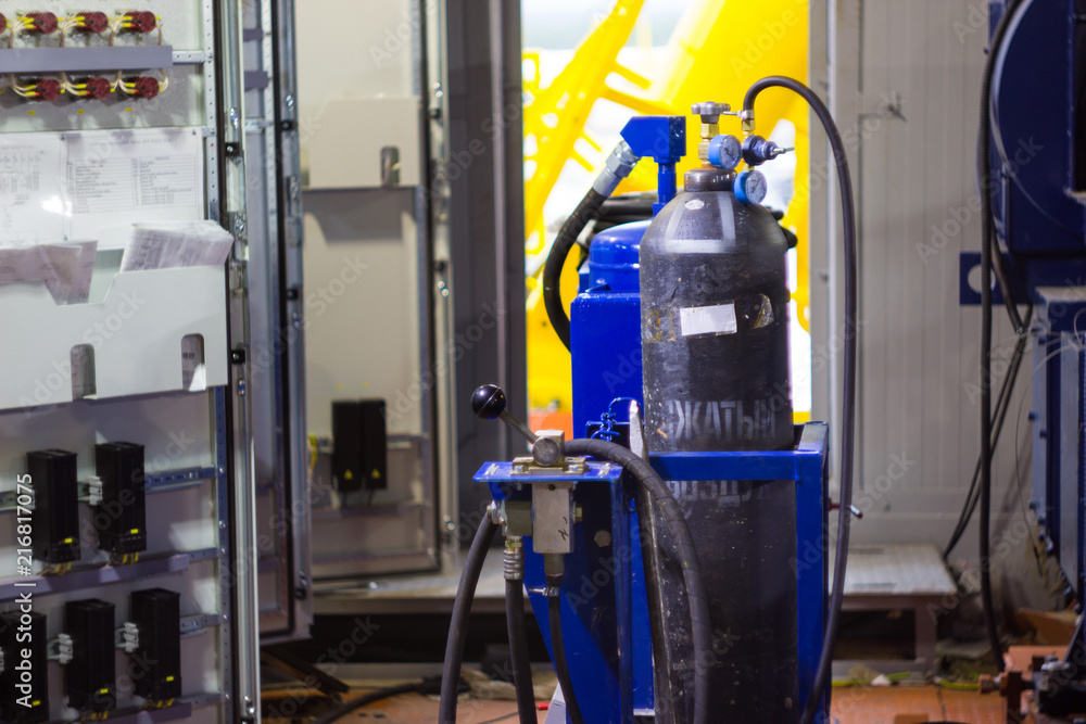 cylinder with compressed air in a production hall Stock Photo | Adobe Stock