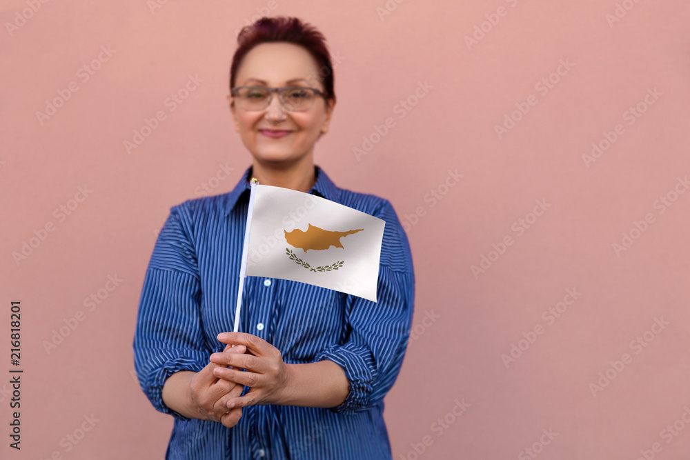 Cyprus flag. Woman holding Cypriot flag. Nice portrait of middle aged ...