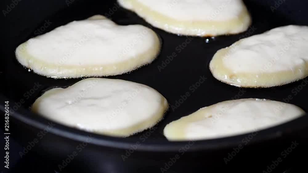 Bubbles on the surface of a pancake, fried in a frying pan. Preparation ...