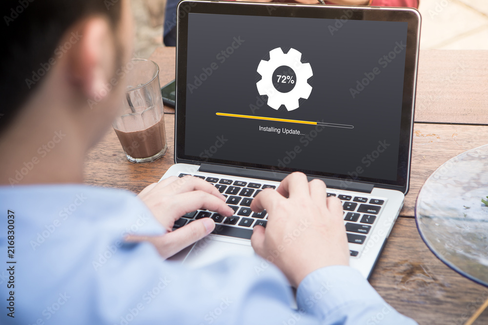 Young man waiting for installing update process with gearbox percentage ...