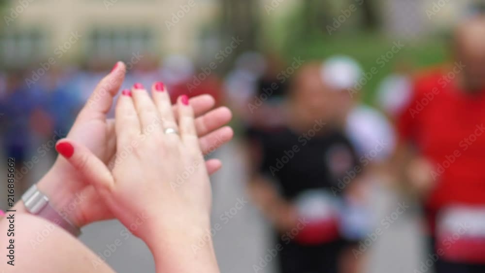 Woman cheering runners and clapping hands in 4k slow motion 60fps Stock ...