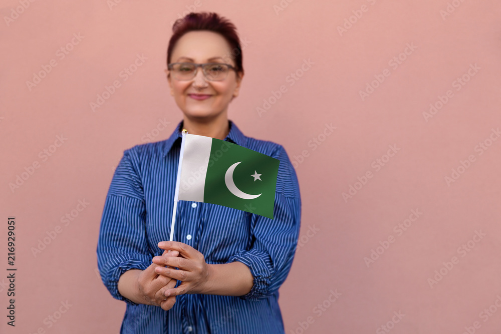 Pakistan flag. Woman holding Pakistani flag. Nice portrait of middle ...